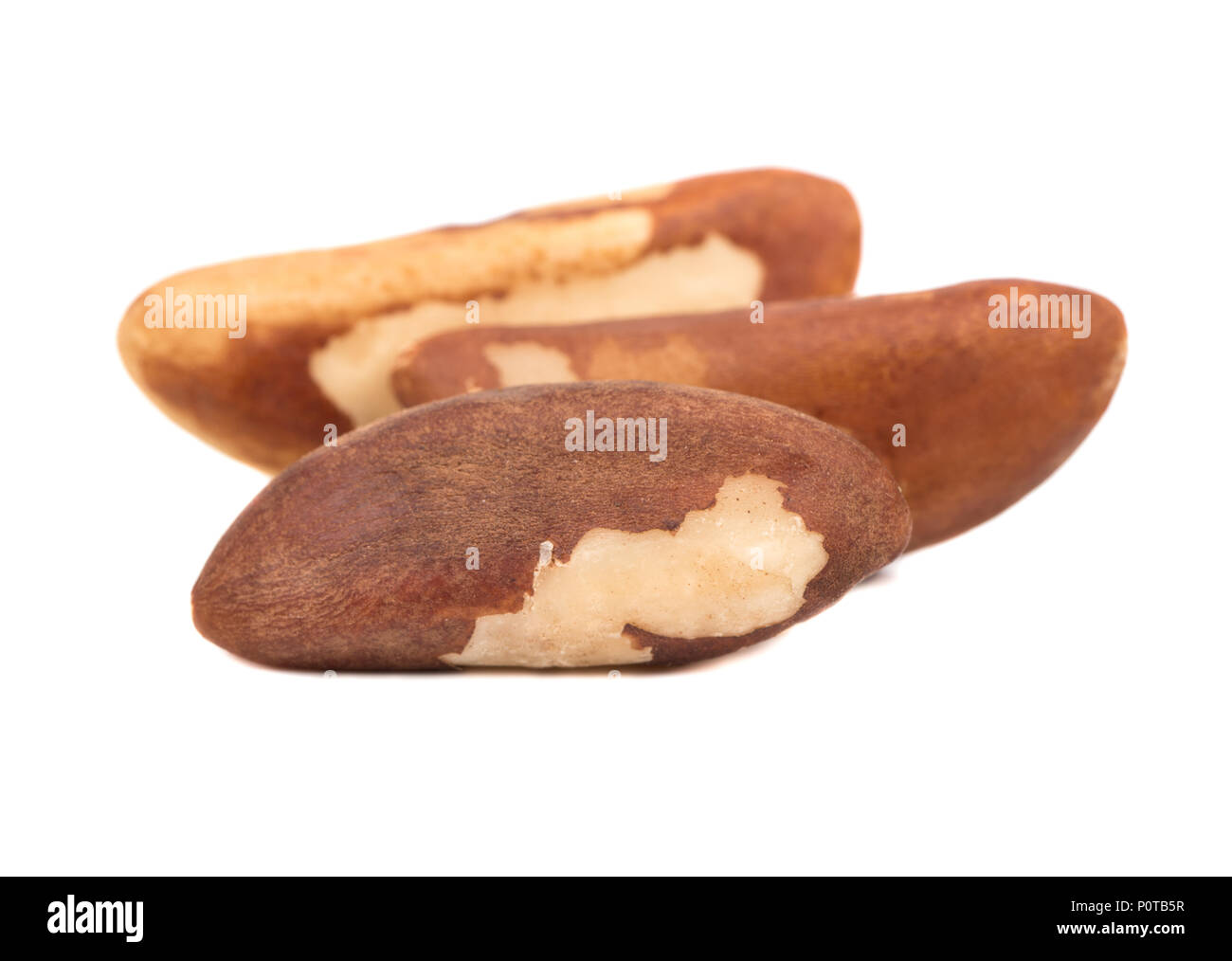 Three Brazil nuts isolated on white background Stock Photo - Alamy