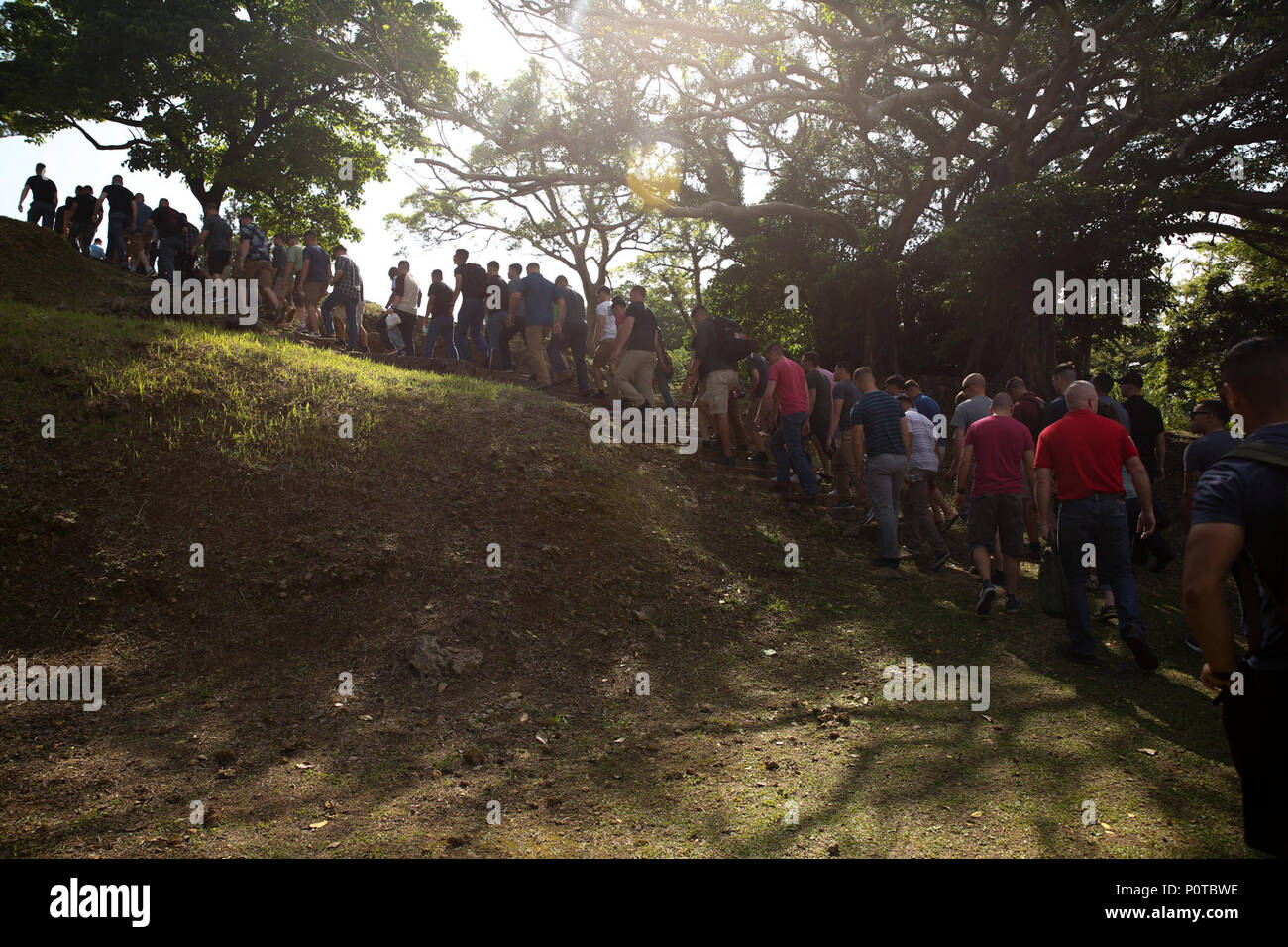 Marines with the 31st Marine Expeditionary Unit hike up a hill at ...