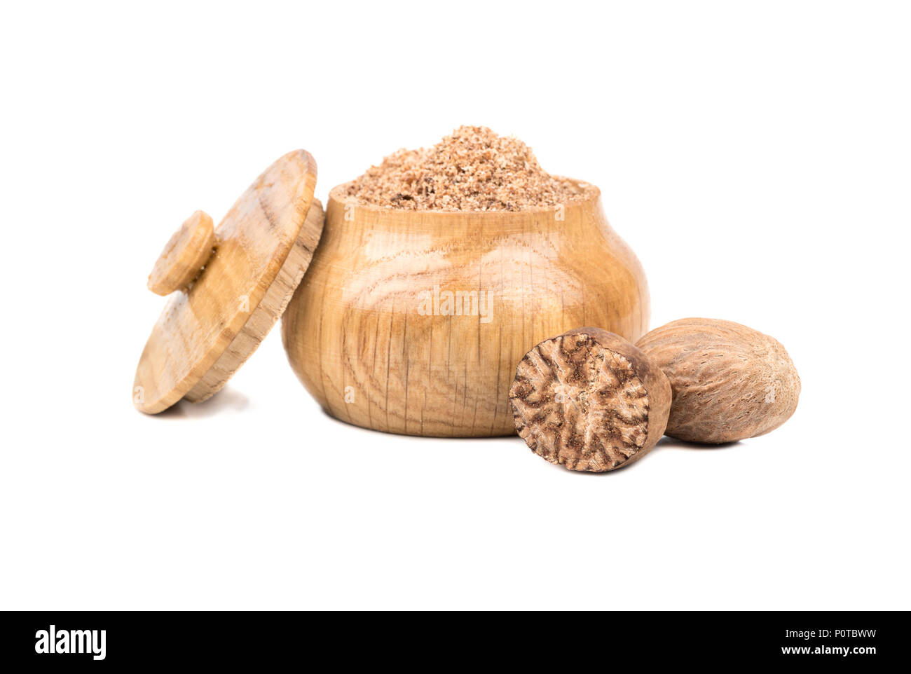 Nutmeg in a wooden jar for spice isolated on a white background Stock ...