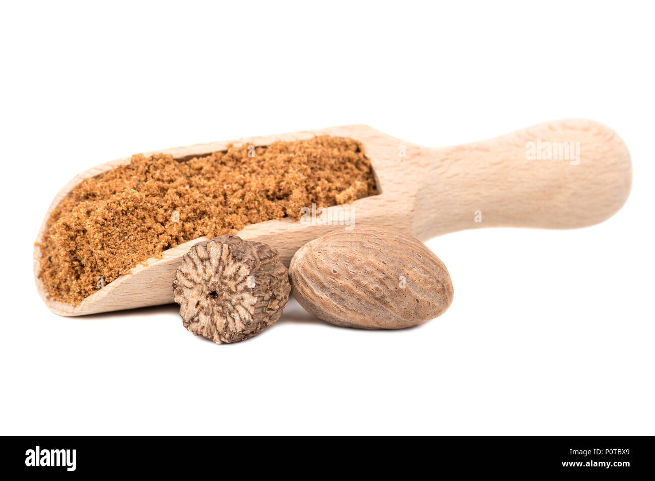 Nutmeg powder in spoon Cut Out Stock Images & Pictures - Alamy