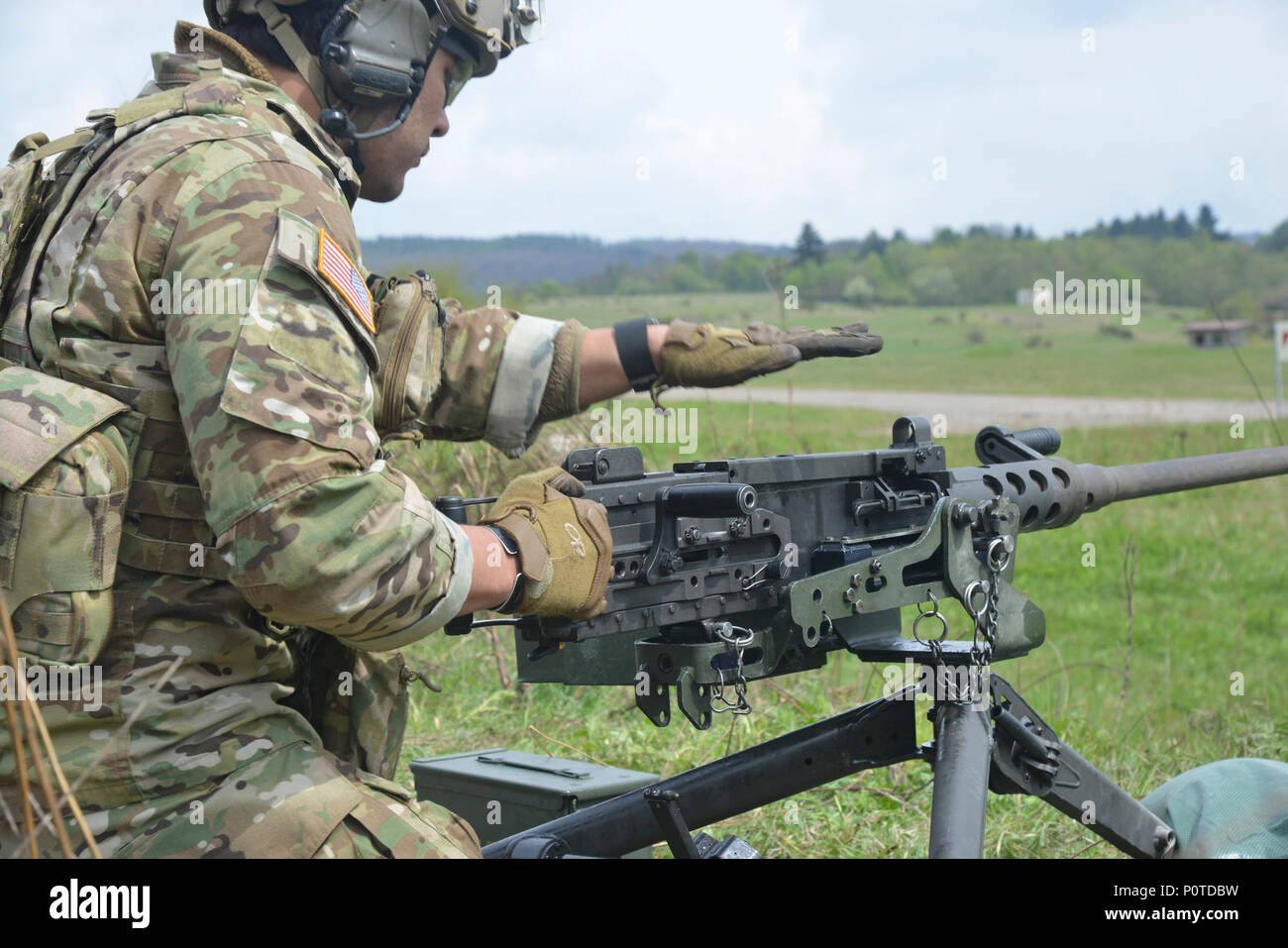 U.S. Soldiers assigned to 1-10th Special Forces Group firing .50 cal ...