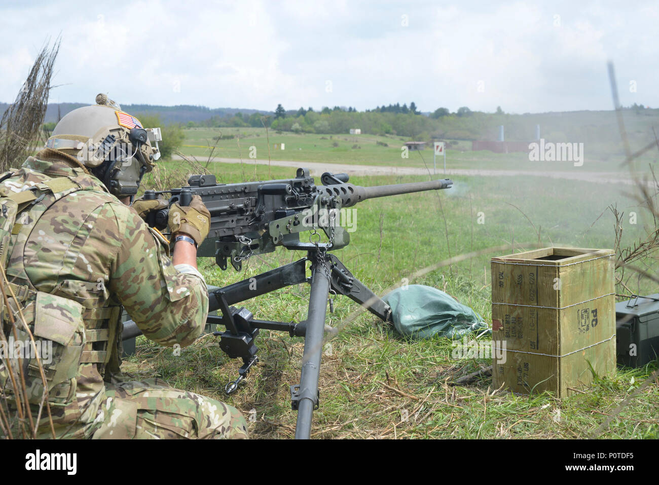 U.S. Soldiers assigned to 1-10th Special Forces Group firing .50 cal ...