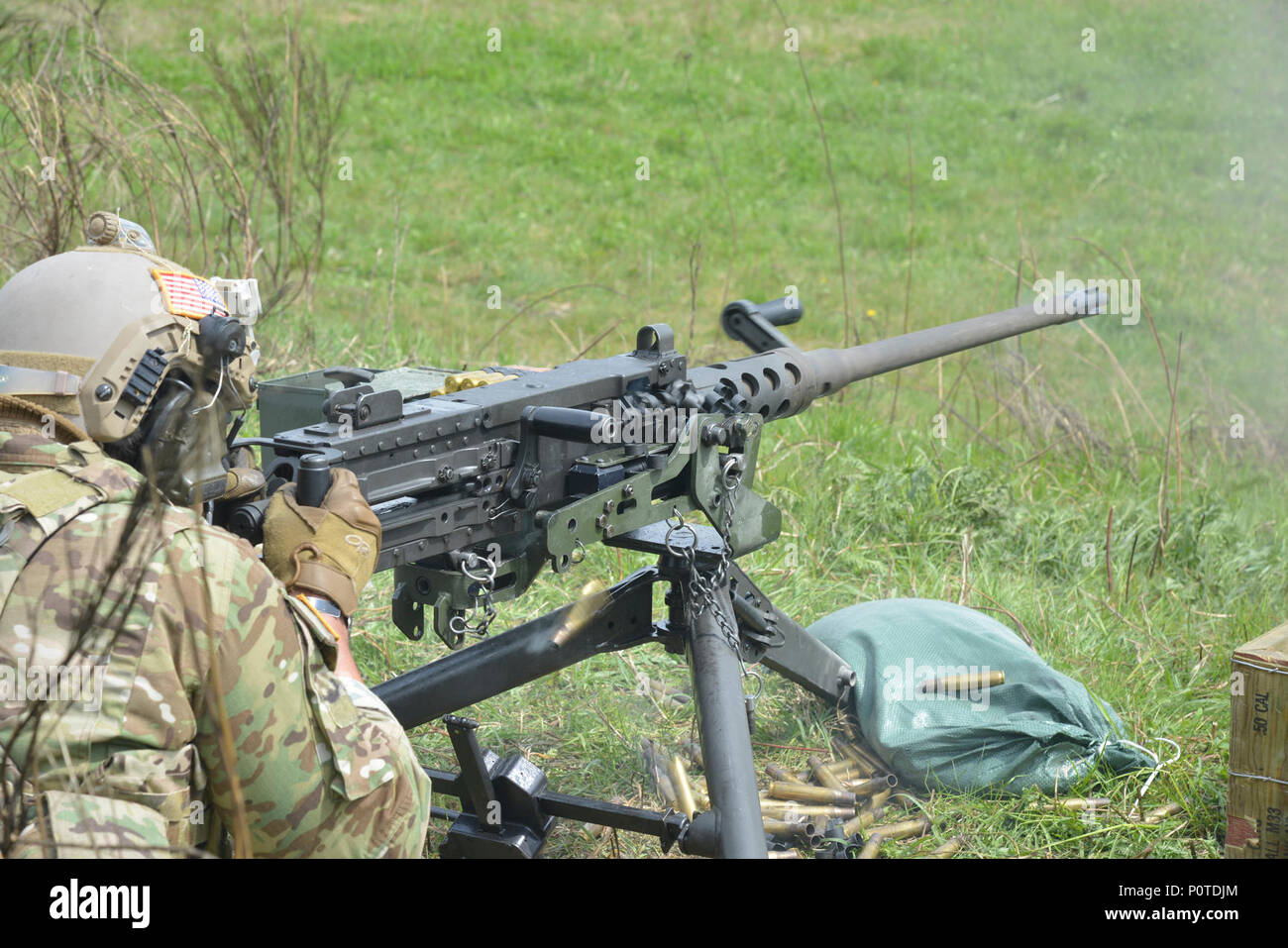 U.S. Soldiers assigned to 1-10th Special Forces Group firing .50 cal ...