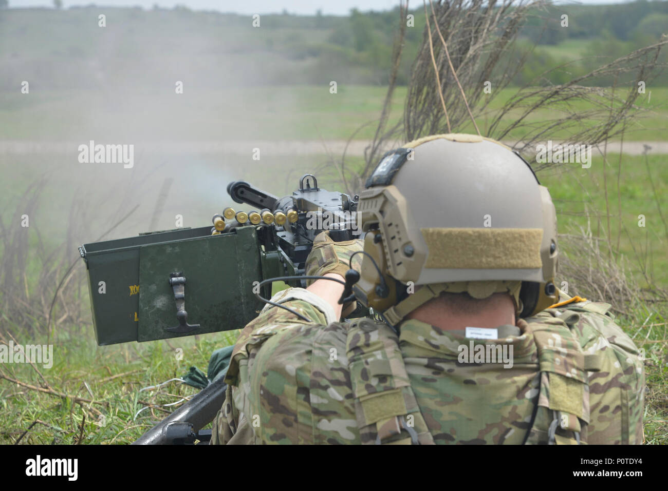 U.S. Soldiers assigned to 1-10th Special Forces Group firing .50 cal ...