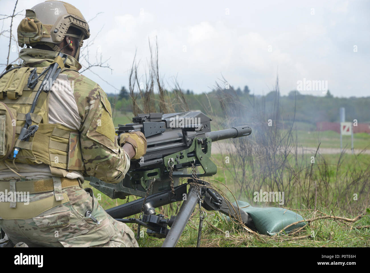 U.S. Soldiers assigned to 1-10th Special Forces Group firing .50 cal ...