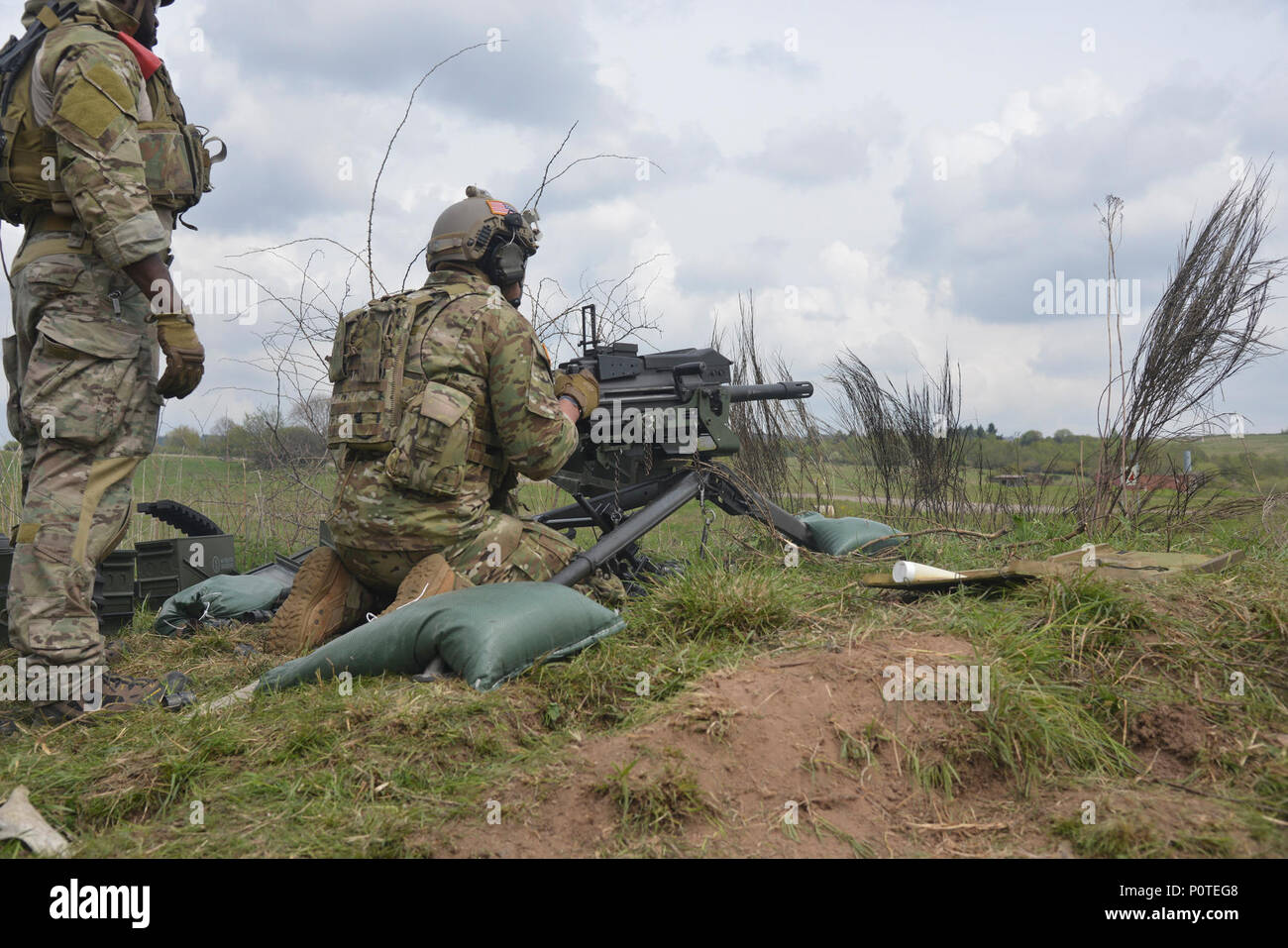 U.S. Soldiers assigned to 1-10th Special Forces Group firing .50 cal ...