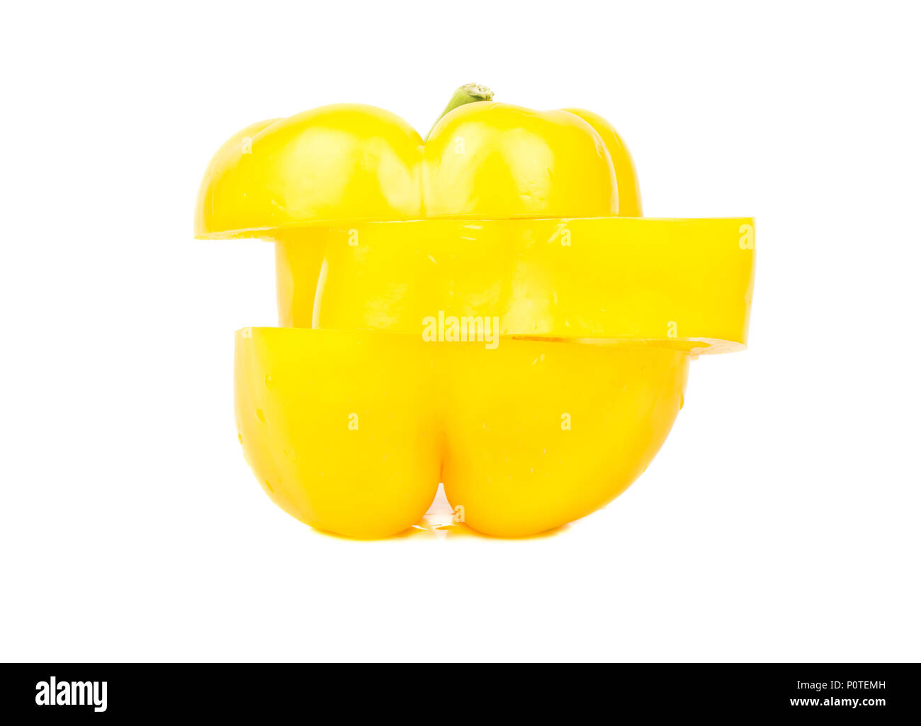 Fresh yellow pepper cut into three pieces on white background Stock ...