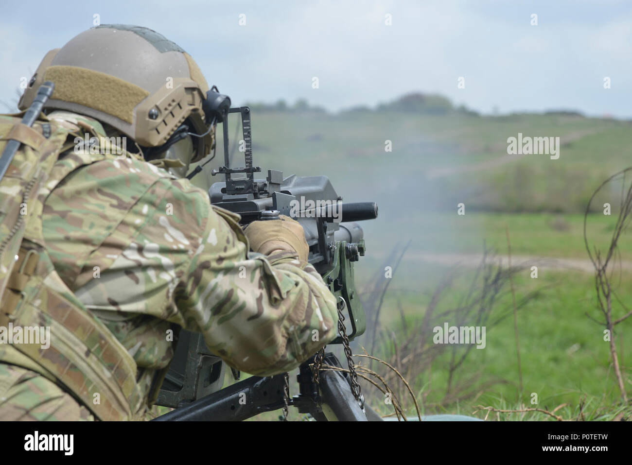 U.S. Soldiers assigned to 1-10th Special Forces Group firing .50 cal ...