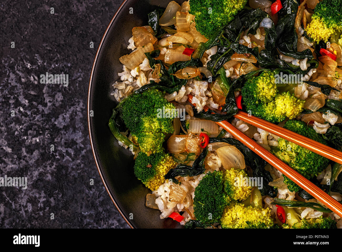 Cooking asian stir fry rice with vegetables, top view, copy space Stock ...
