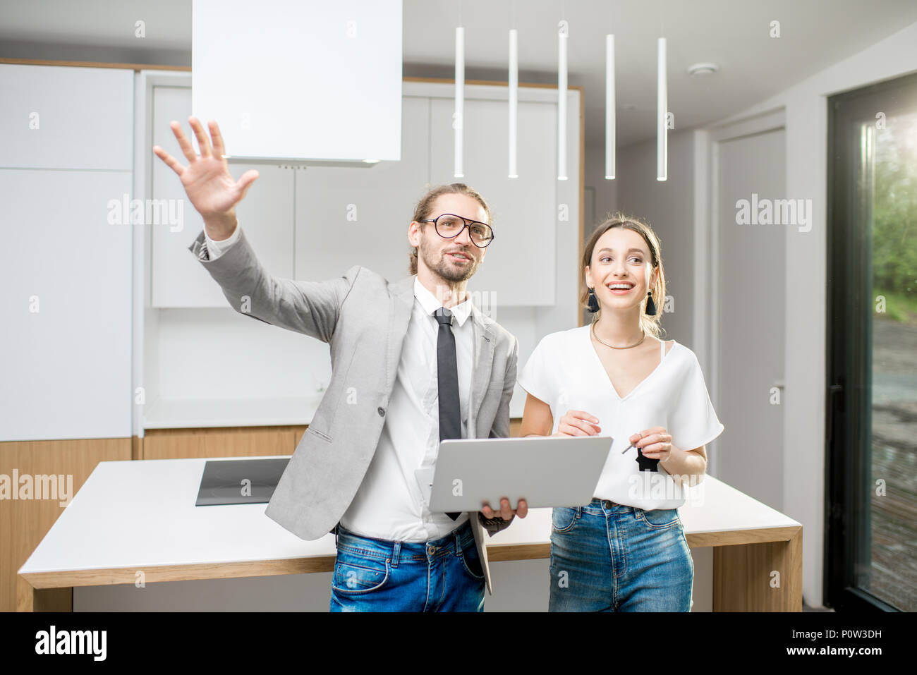 Designer with woman client planning interior Stock Photo - Alamy