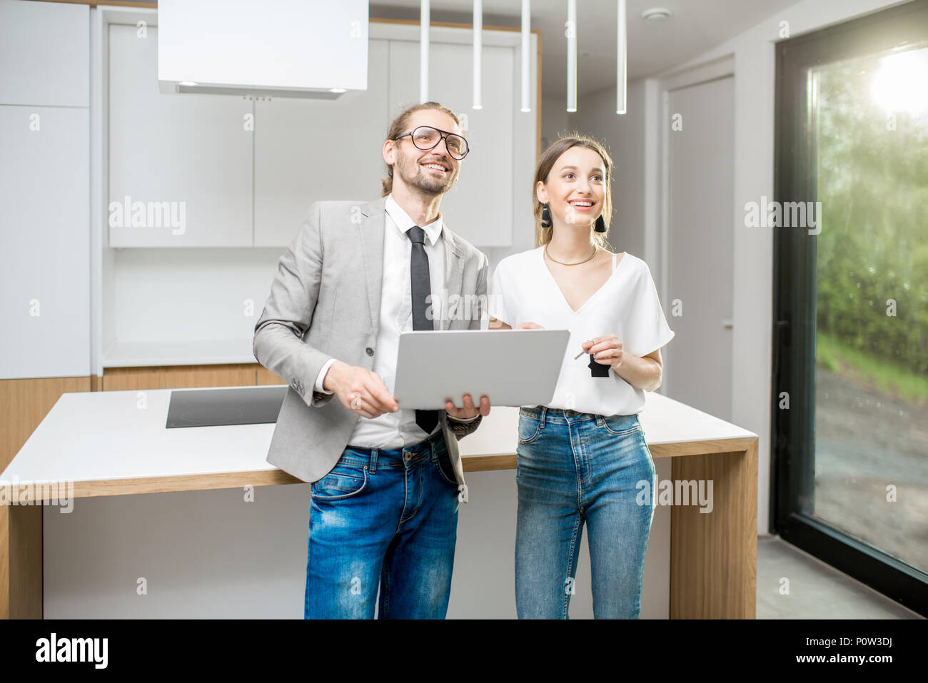 Designer with woman client planning interior Stock Photo - Alamy