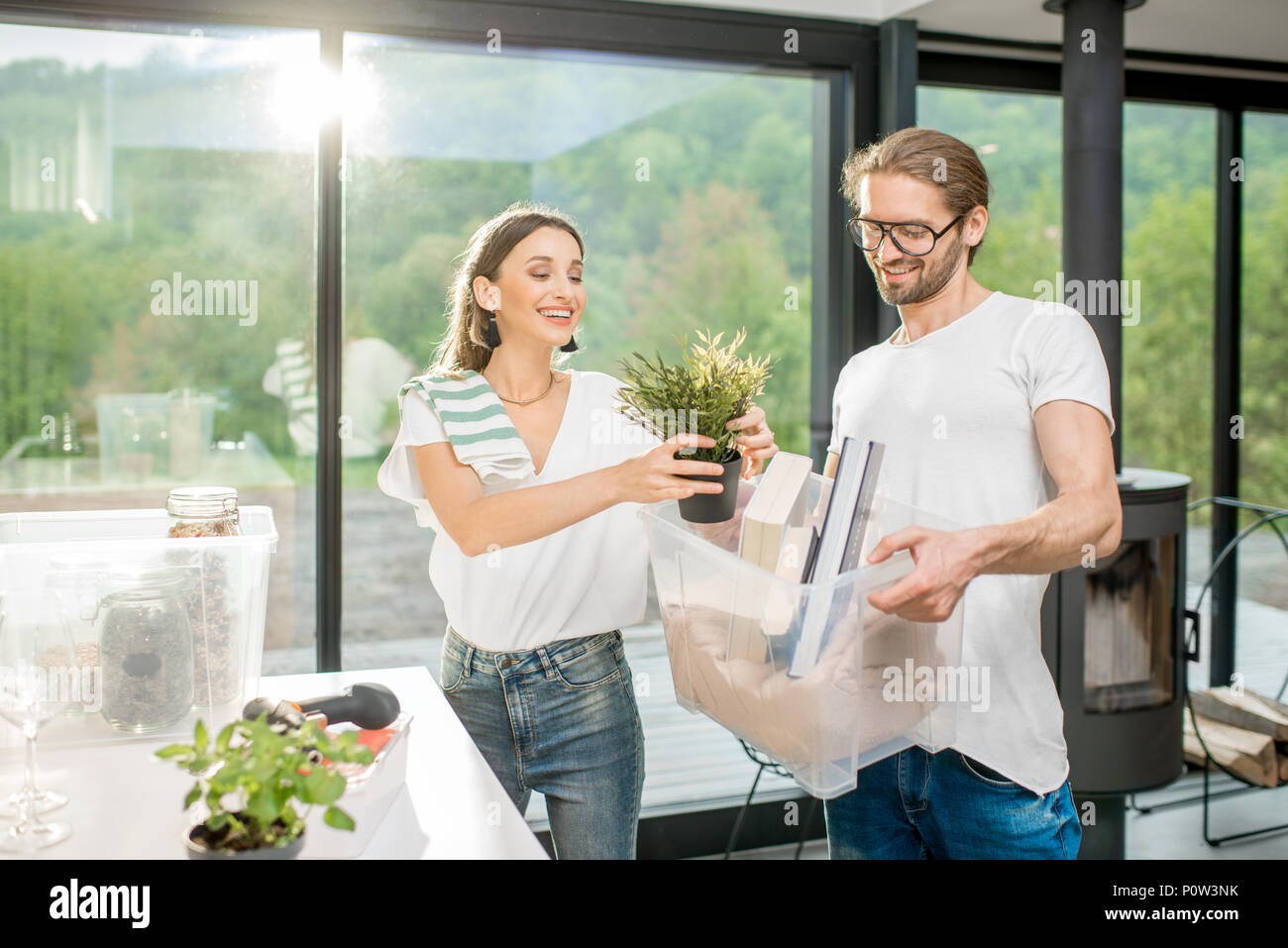Couple making order in their new modern house Stock Photo - Alamy
