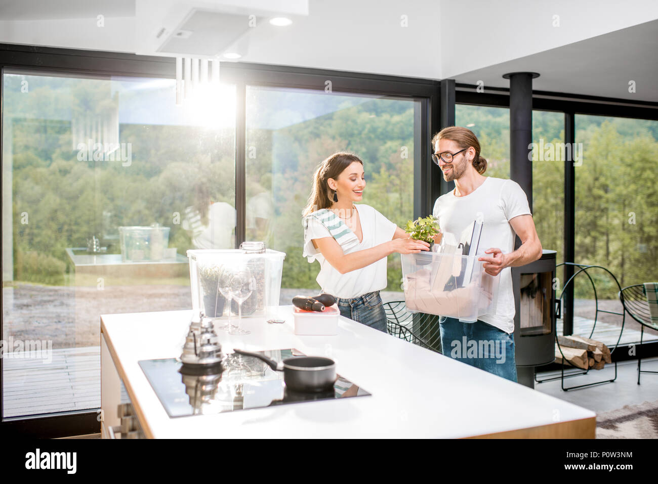 Couple making order in their new modern house Stock Photo - Alamy