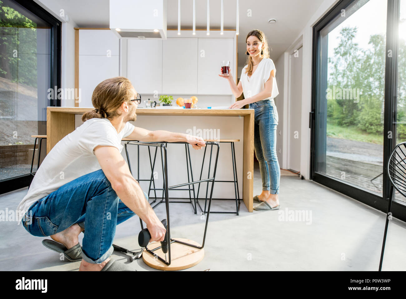 Couple doing chores together hi-res stock photography and images - Alamy