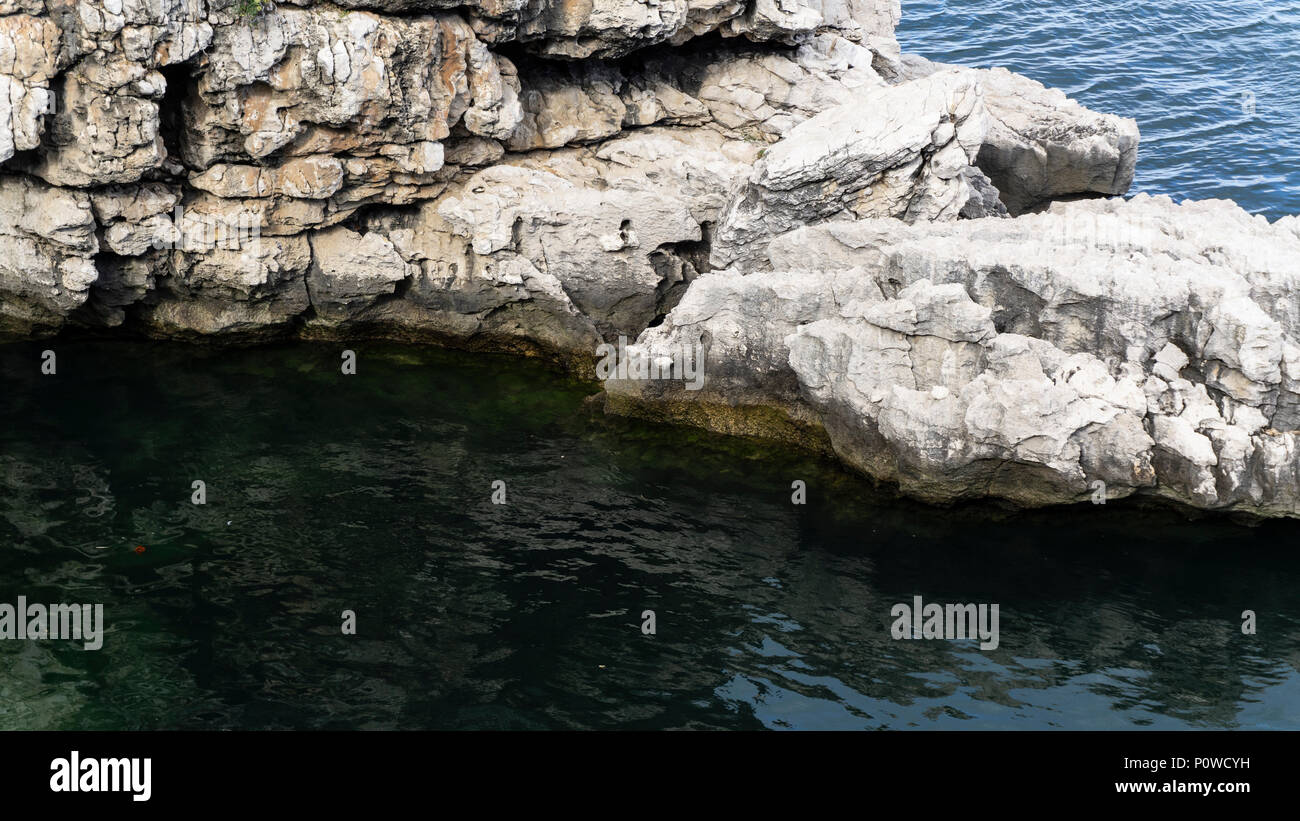 Clear and crystalline sea with white rocks Stock Photo - Alamy