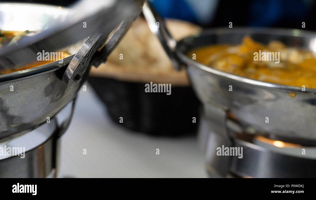 Typical spicy Indian food and served in Typical metal containers Stock ...