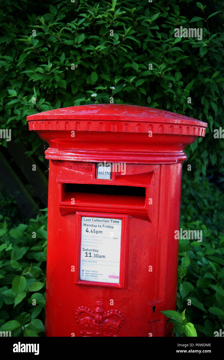 Red Post box sighted at a Tesco site Stock Photo - Alamy