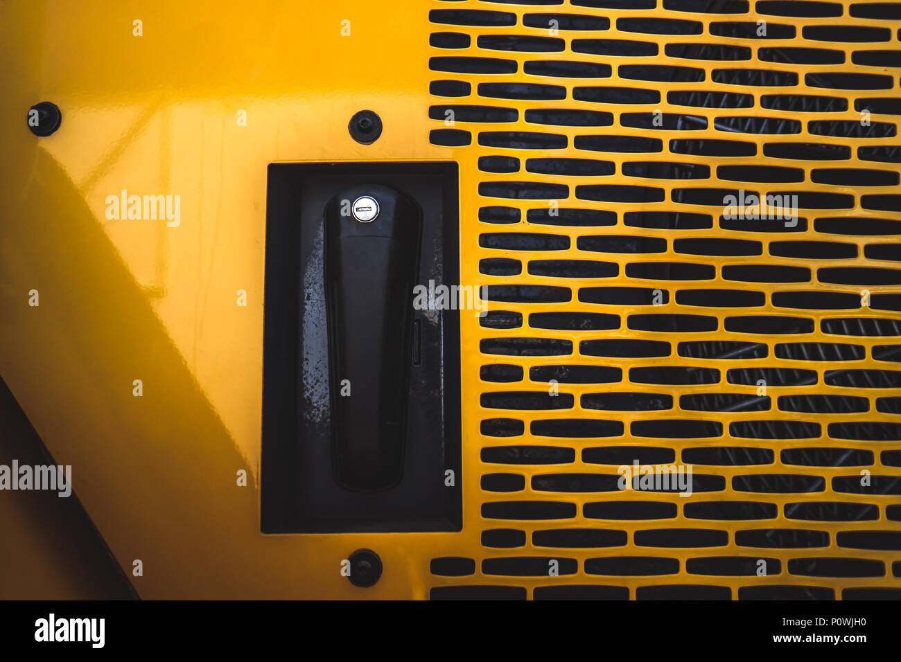 yellow front Grille of the new farm tractor Stock Photo - Alamy