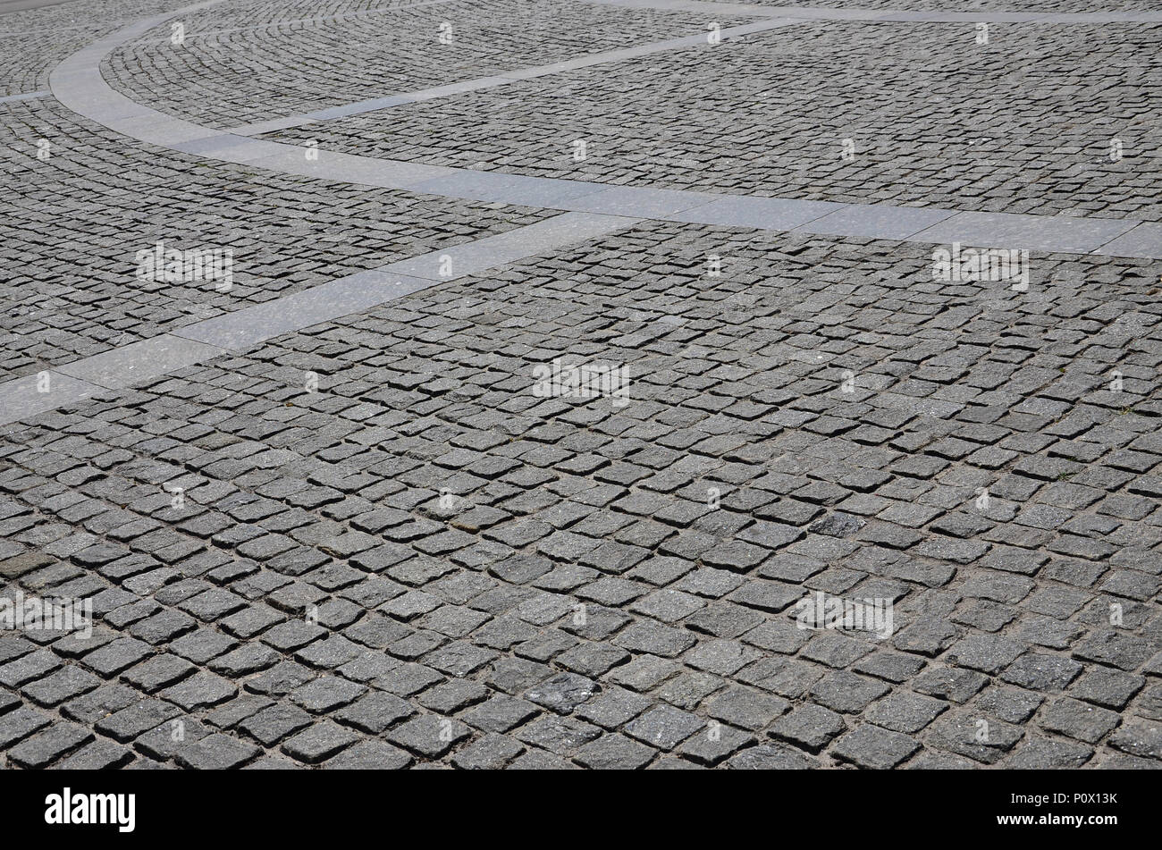 The texture of the paving slab (paving stones) of many small stones of ...