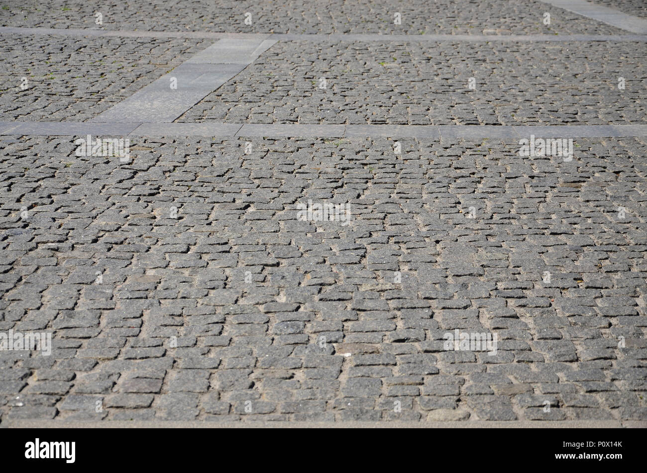 The texture of the paving slab (paving stones) of many small stones of ...