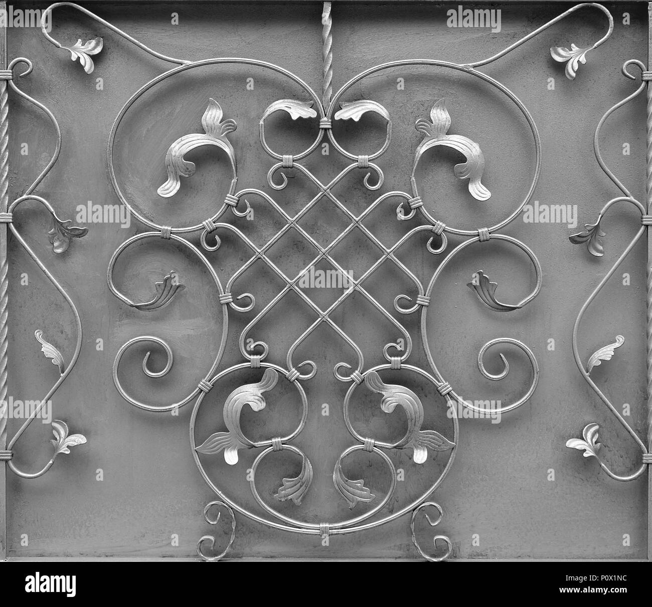 The texture of the silver metal gate with a beautiful floral pattern of ...