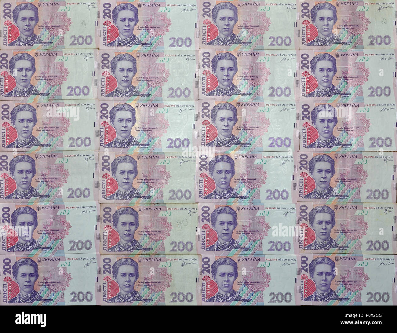 A close-up of a pattern of many Ukrainian currency banknotes with a par ...
