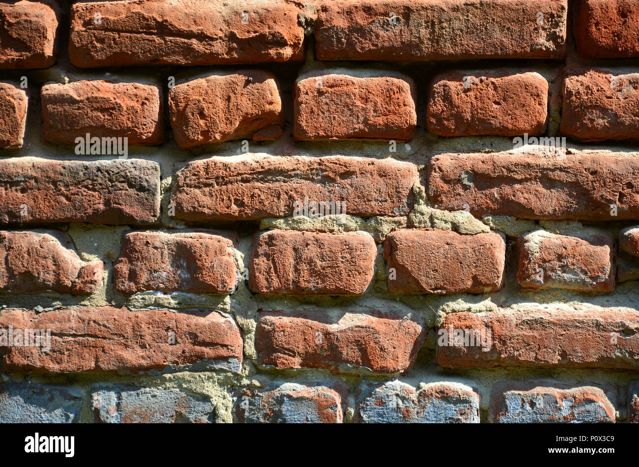 Horizontal wall texture of several rows of very old brickwork made of ...