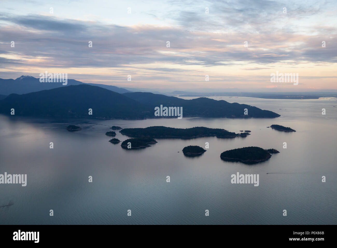 Aerial view of the Islands in Howe Sound during a vibrant sunset. Taken ...