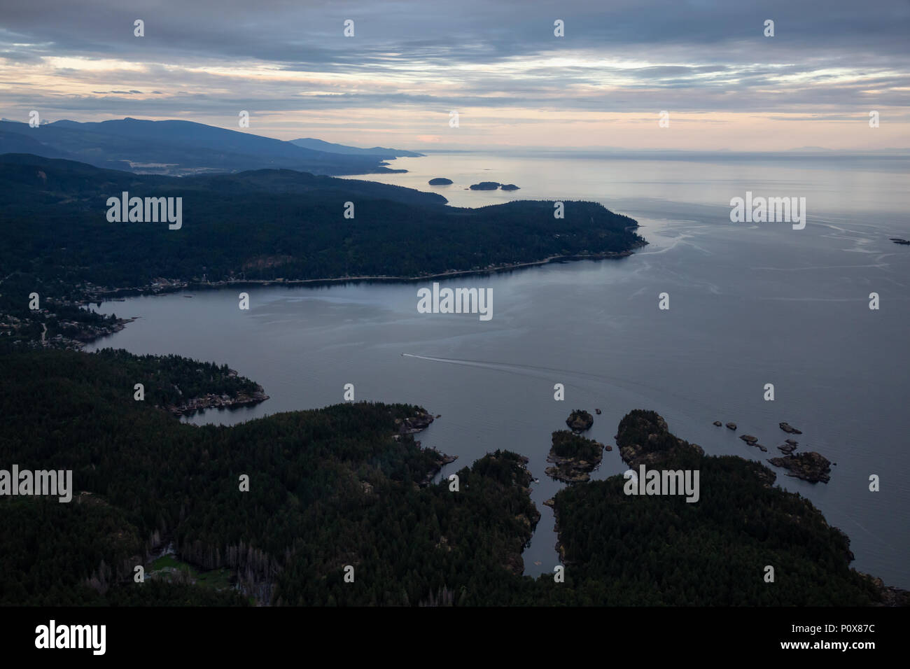 Aerial view of Sunshine Coast during a vibrant cloudy sunset. Located ...