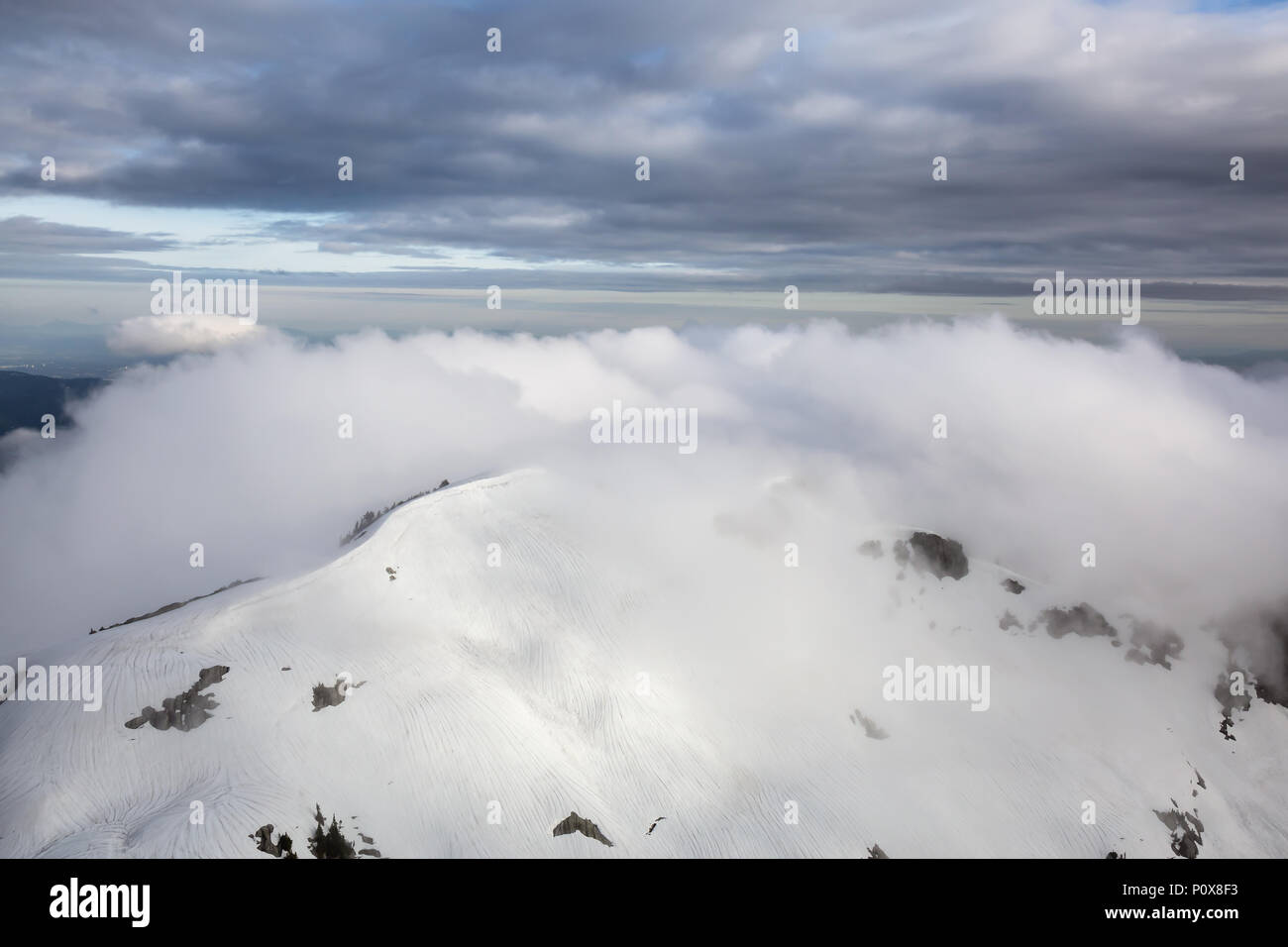 Aerial view of the striking Canadian Mountain Landscape covered in ...
