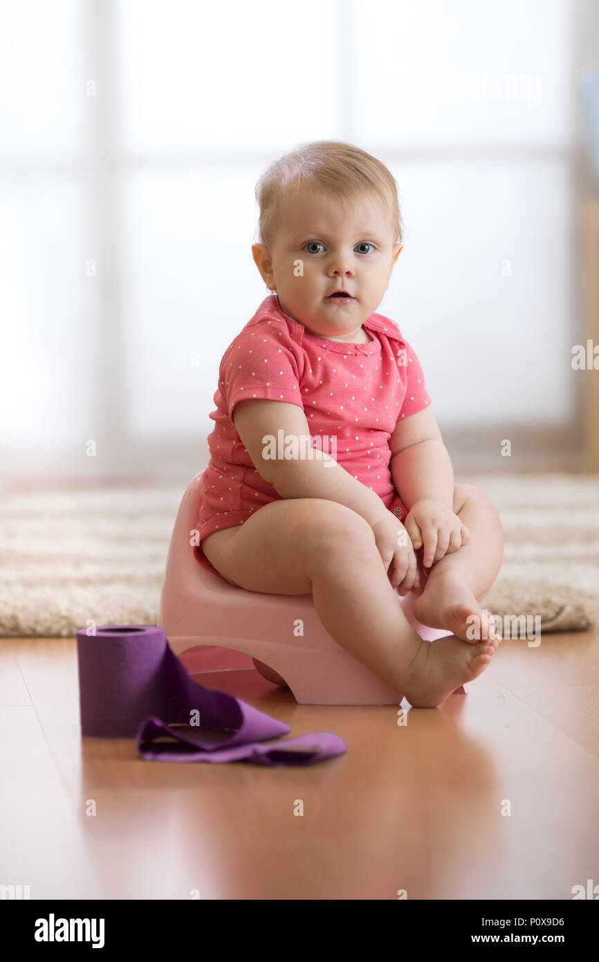 funny child girl sitting on chamberpot Stock Photo - Alamy