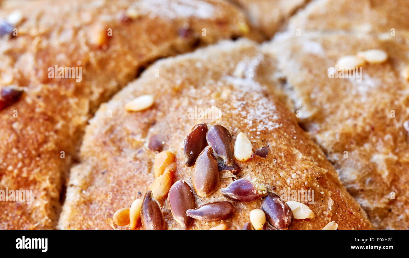 Close up picture of a whole wheat bread crust with flax and sesame ...
