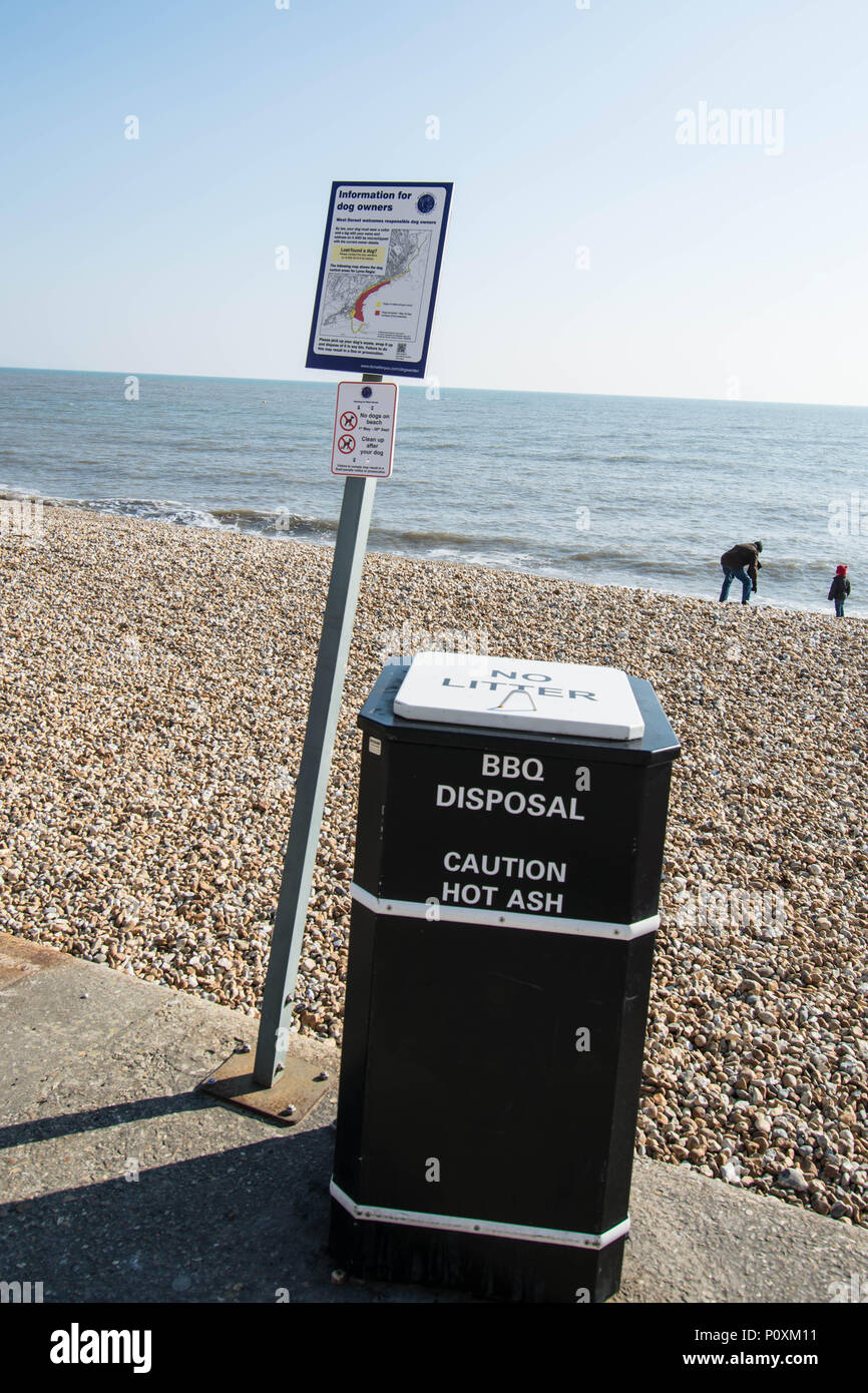 Litter bin sign beach shingles sea people map pole BBQ caution lid hot ...