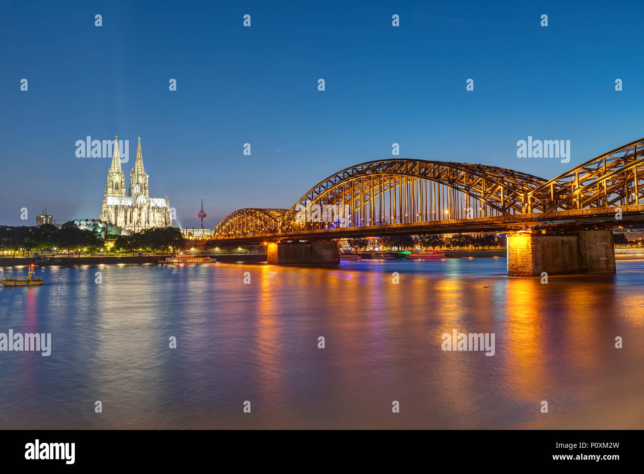 The famous Cologne Cathedral and the Hohenzollern railway bridge at ...