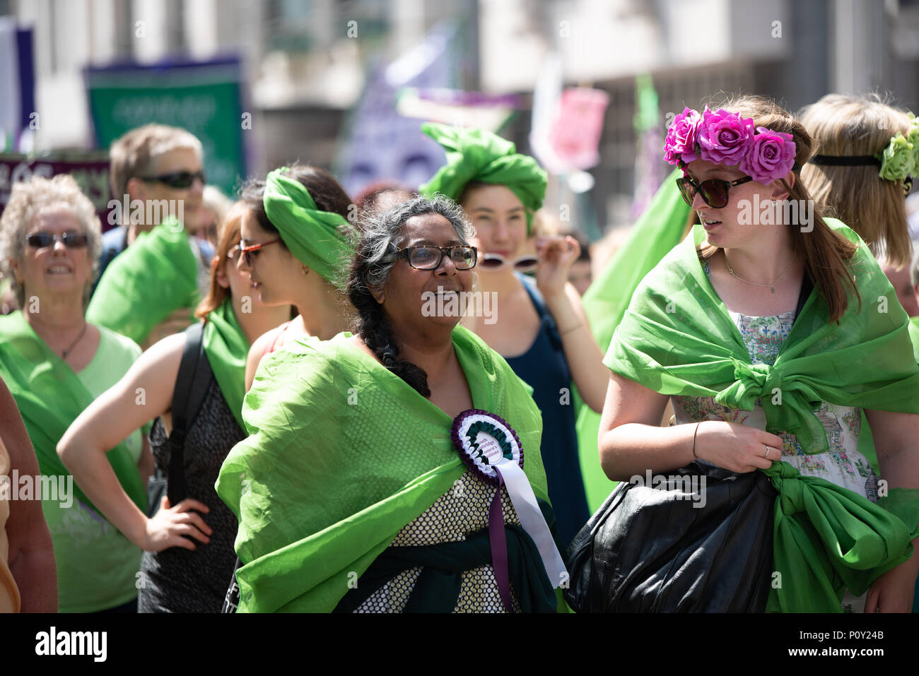Women marching through London to mark 100 years since the first British ...