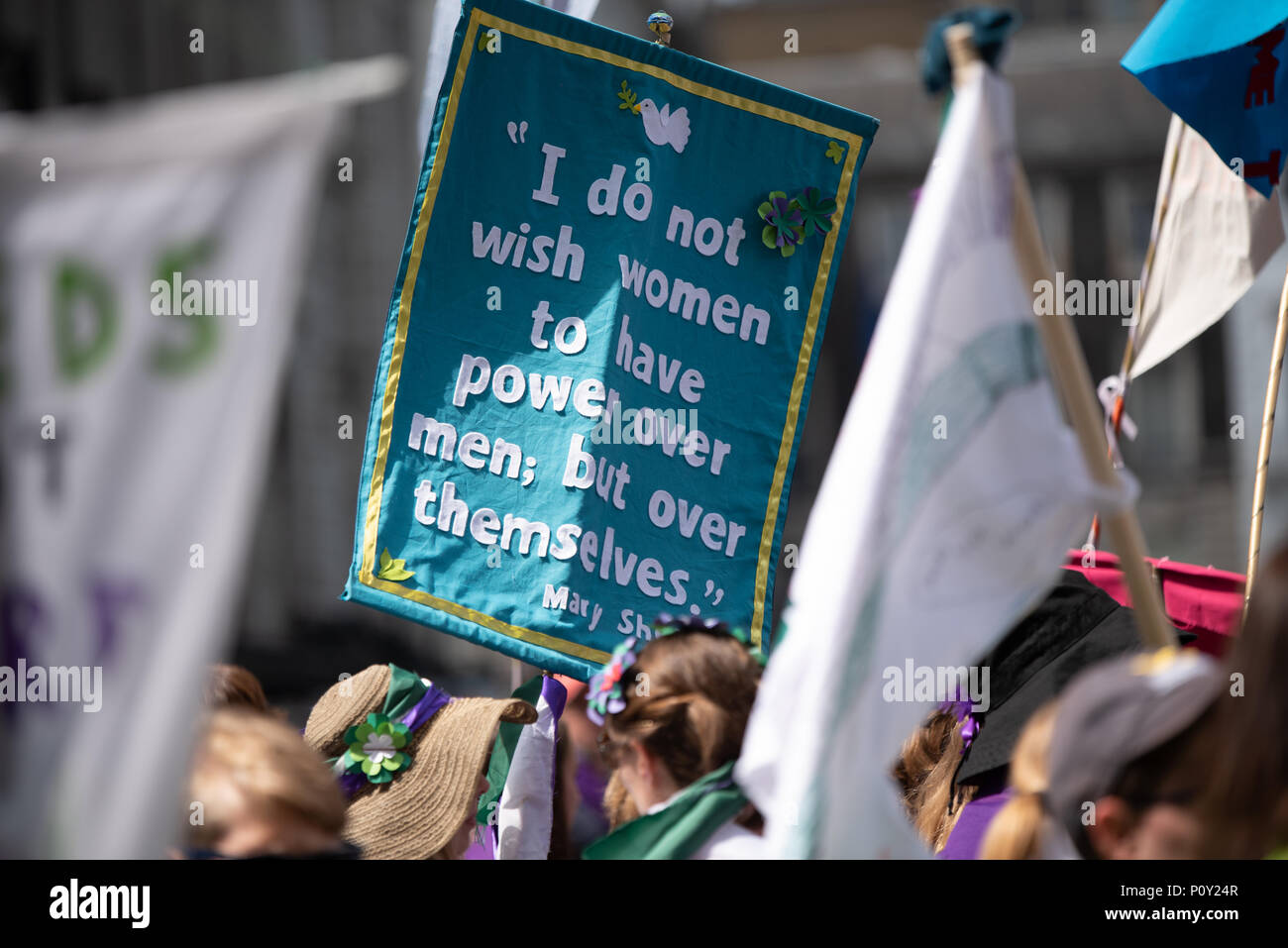Women marching through London to mark 100 years since the first British ...
