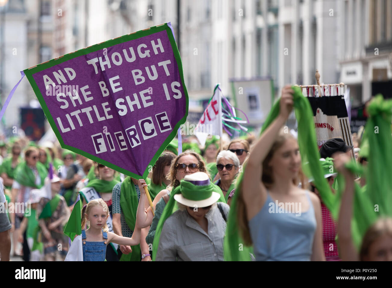 Women marching through London to mark 100 years since the first British ...