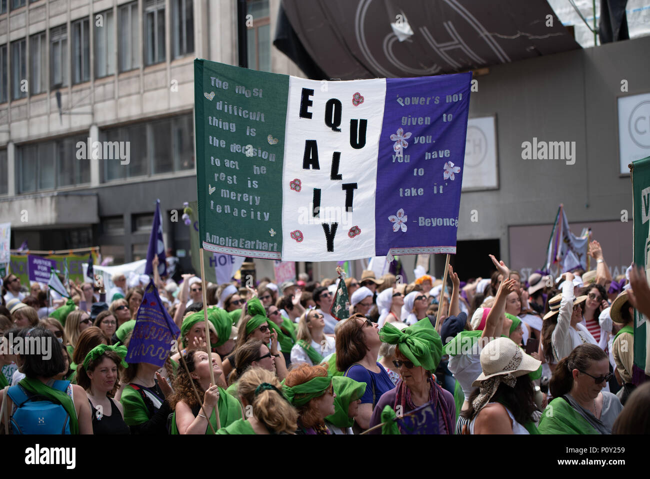 Women marching through London to mark 100 years since the first British ...