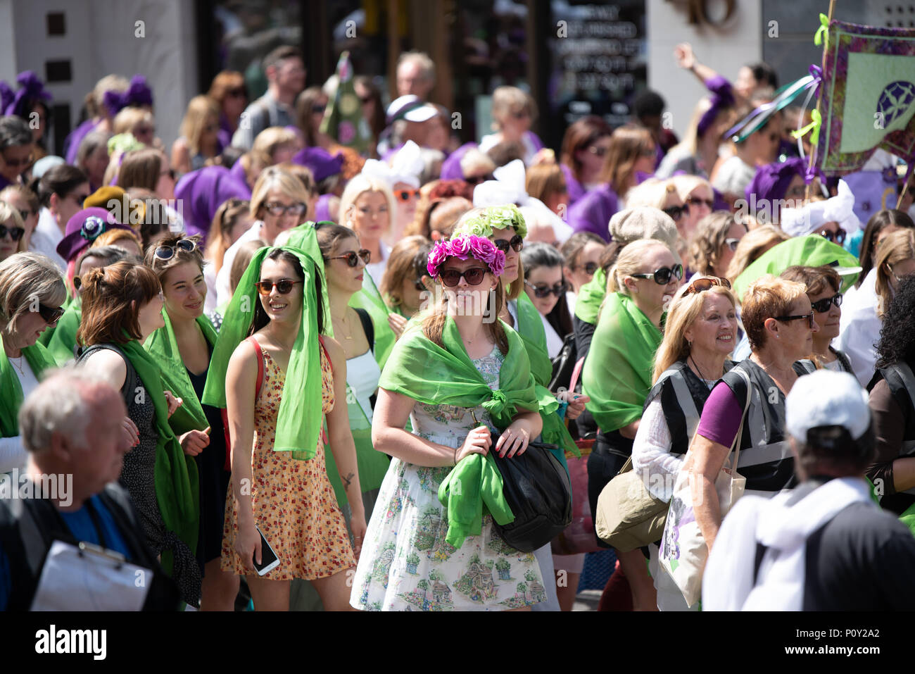 Women marching through London to mark 100 years since the first British ...
