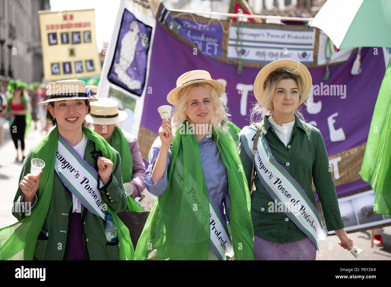 Women marching through London to mark 100 years since the first British ...