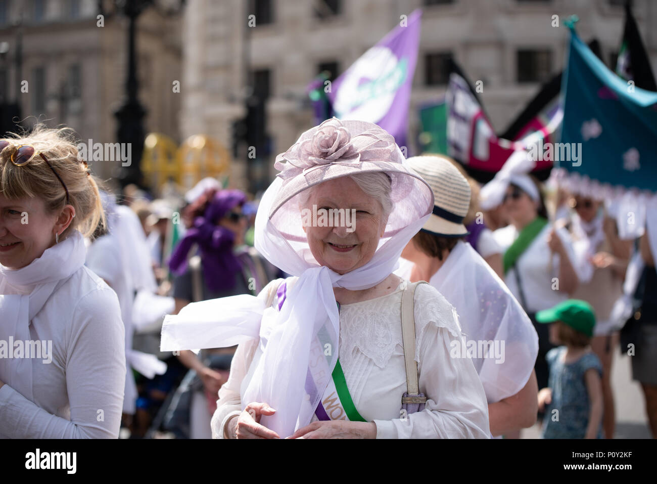 Women marching through London to mark 100 years since the first British ...