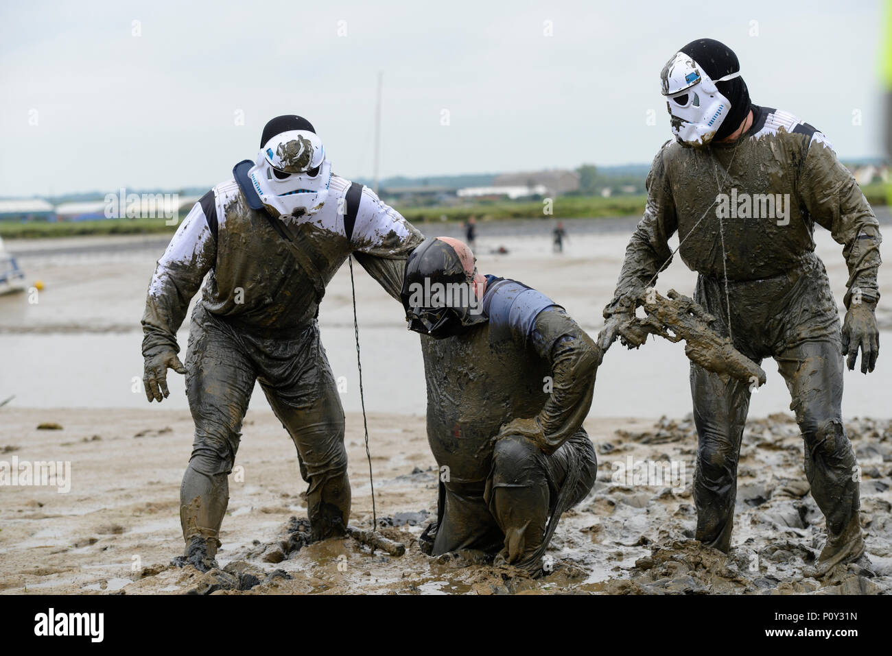 Maldon Mud Race competitor in the slimy mud of the River Chelmer, Essex ...
