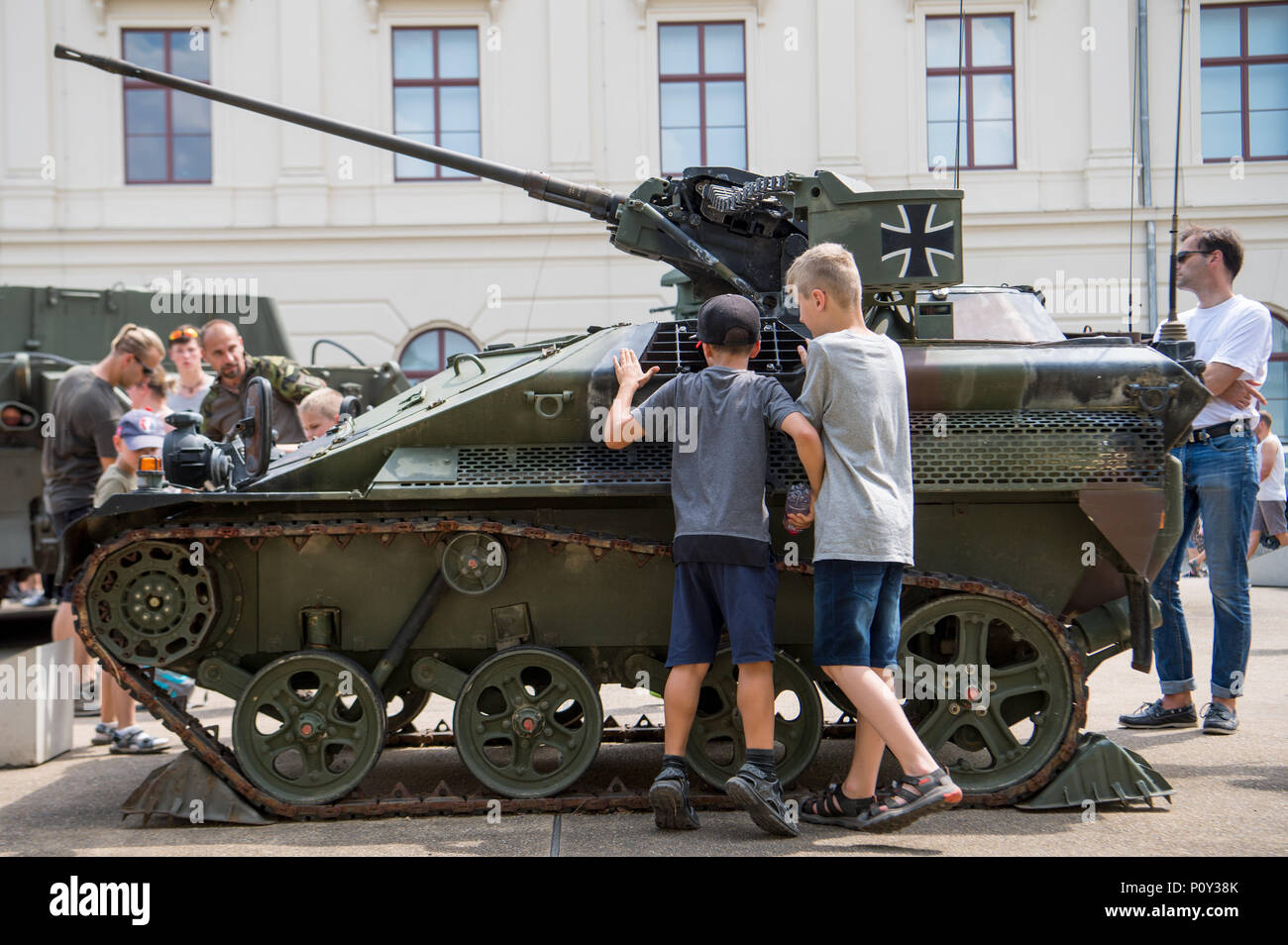 09 June 2018, Germany, Dresden: Two boys examine a weapon carrier of ...