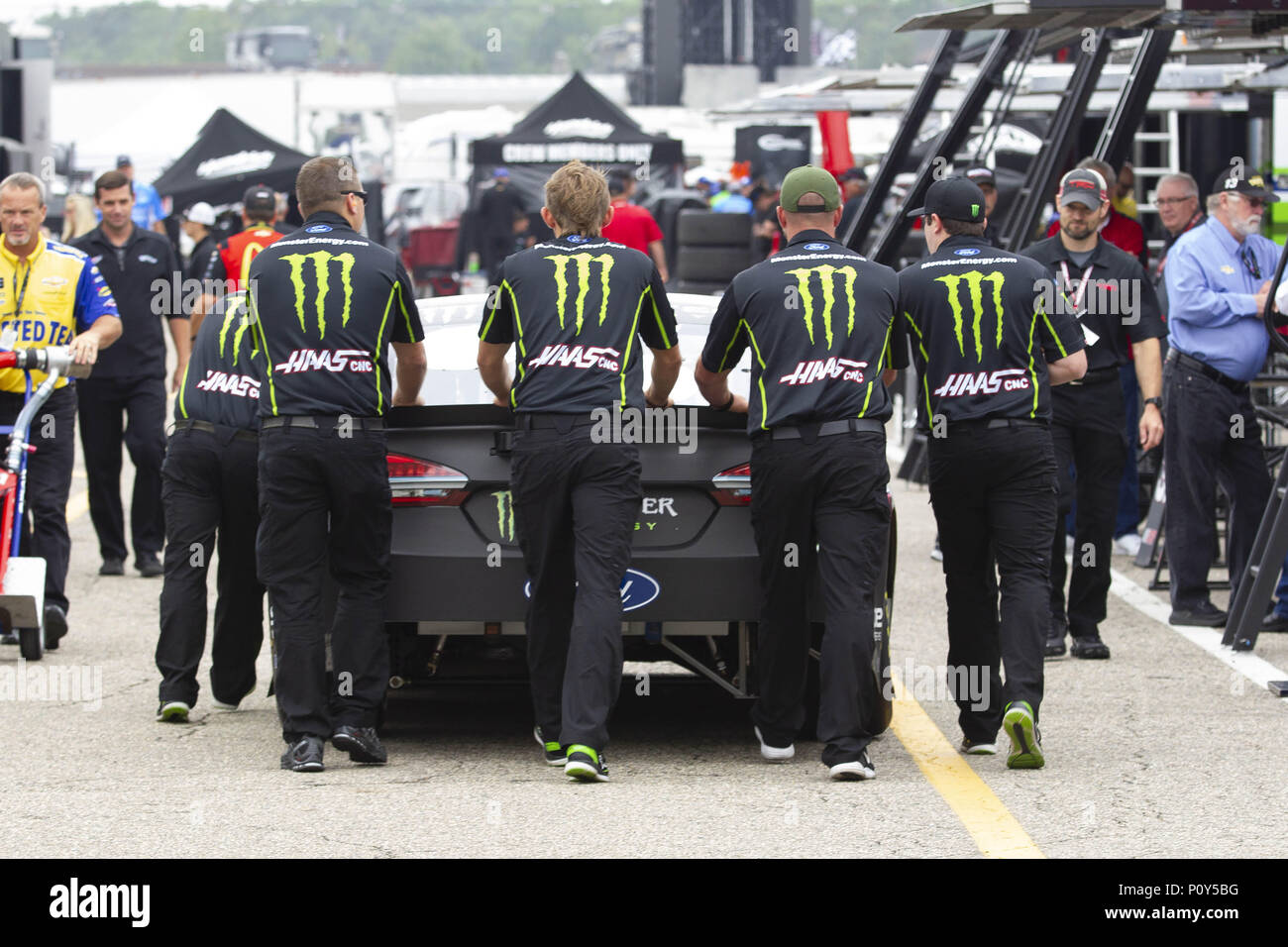 Brooklyn, Michigan, USA. 10th June, 2018. Crew members of the Monster ...