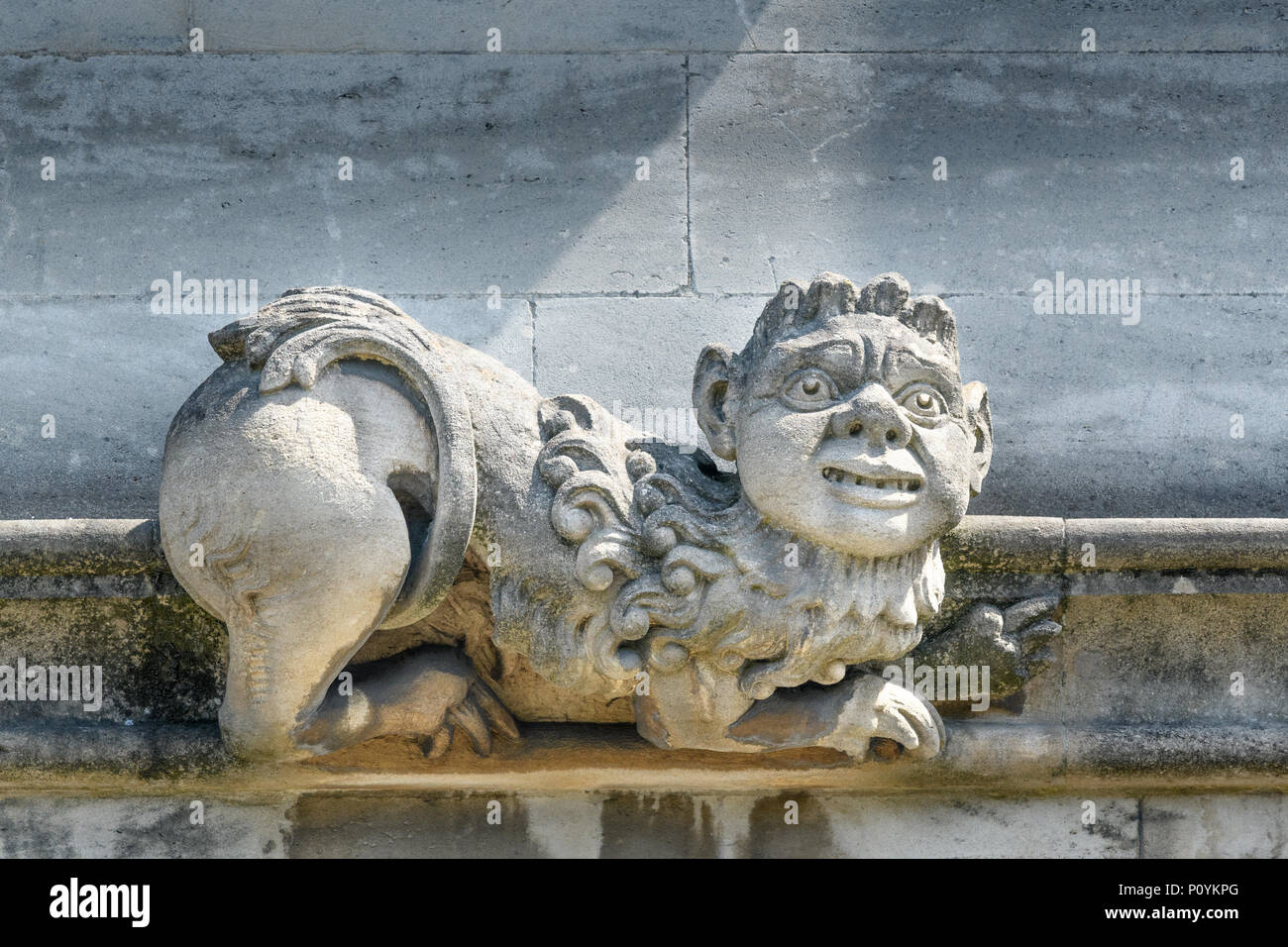 Stone carving (of a grotesque monster) on an outside wall at Magdalen ...