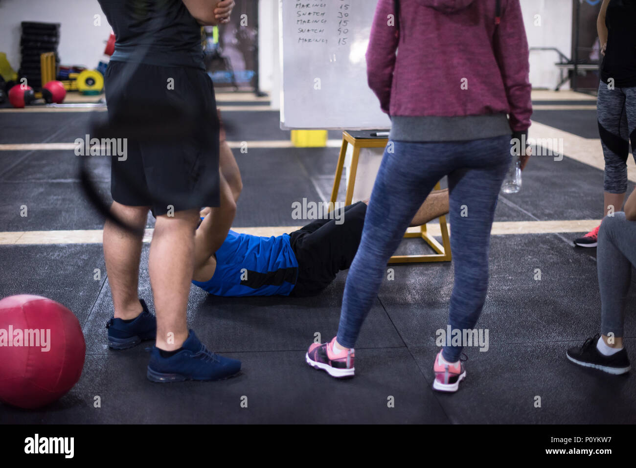 Training course.group of young athletes getting instructions from ...