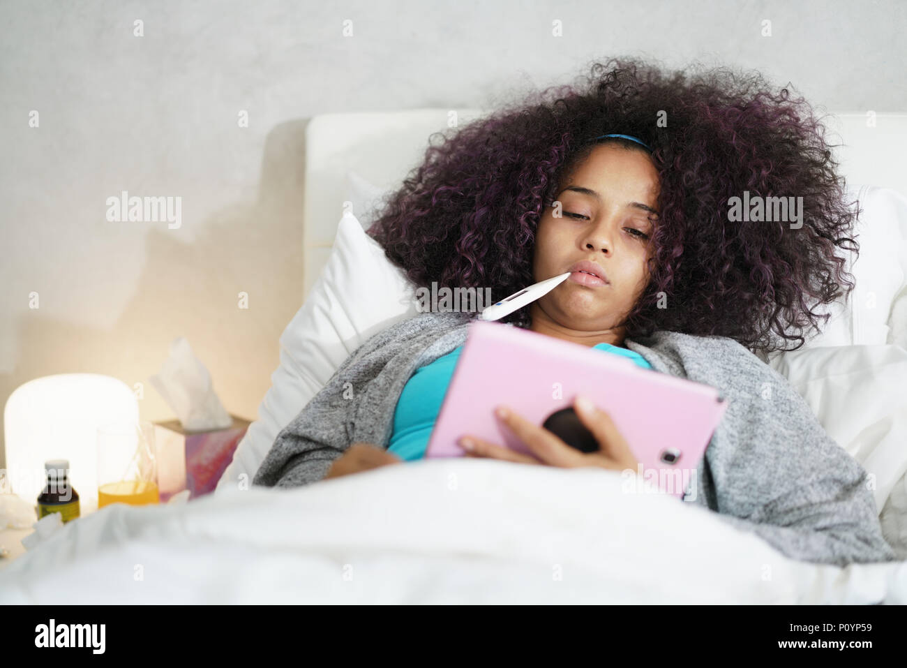 Teenager fever thermometer hi-res stock photography and images - Alamy