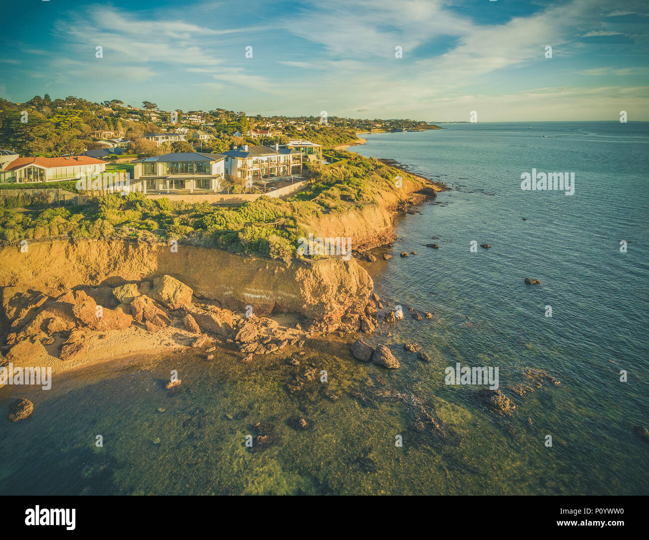 Aerial view of coastal cliff and luxury villas on Mornington Peninsula ...