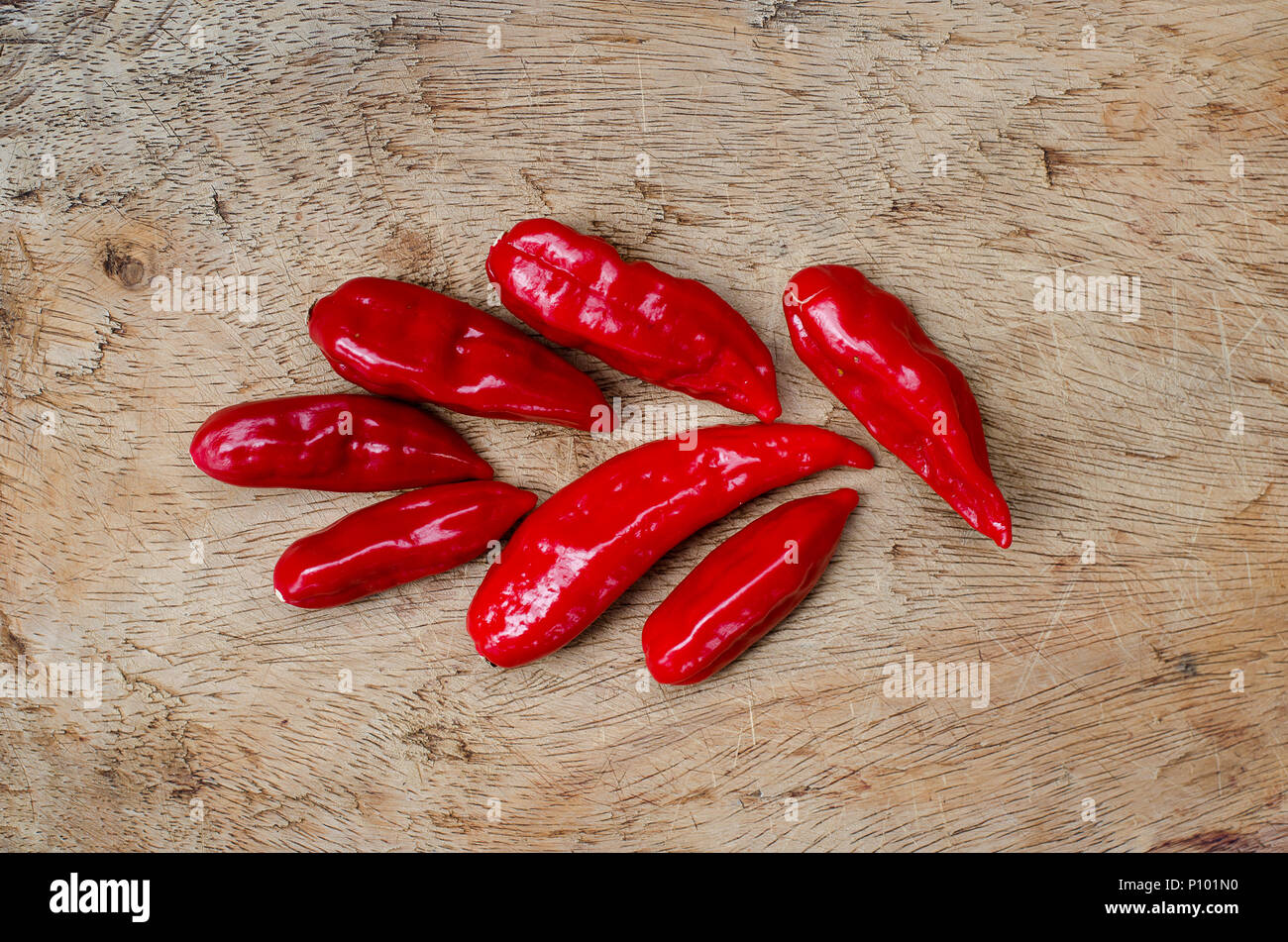 Fresh ripe peppers displayed on a table, showcasing their vibrant ...