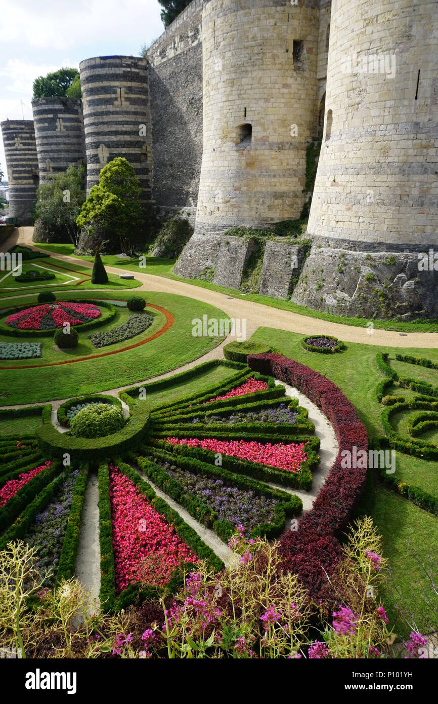The beautiful and colorful outdoor gardens of the medieval old castle ...